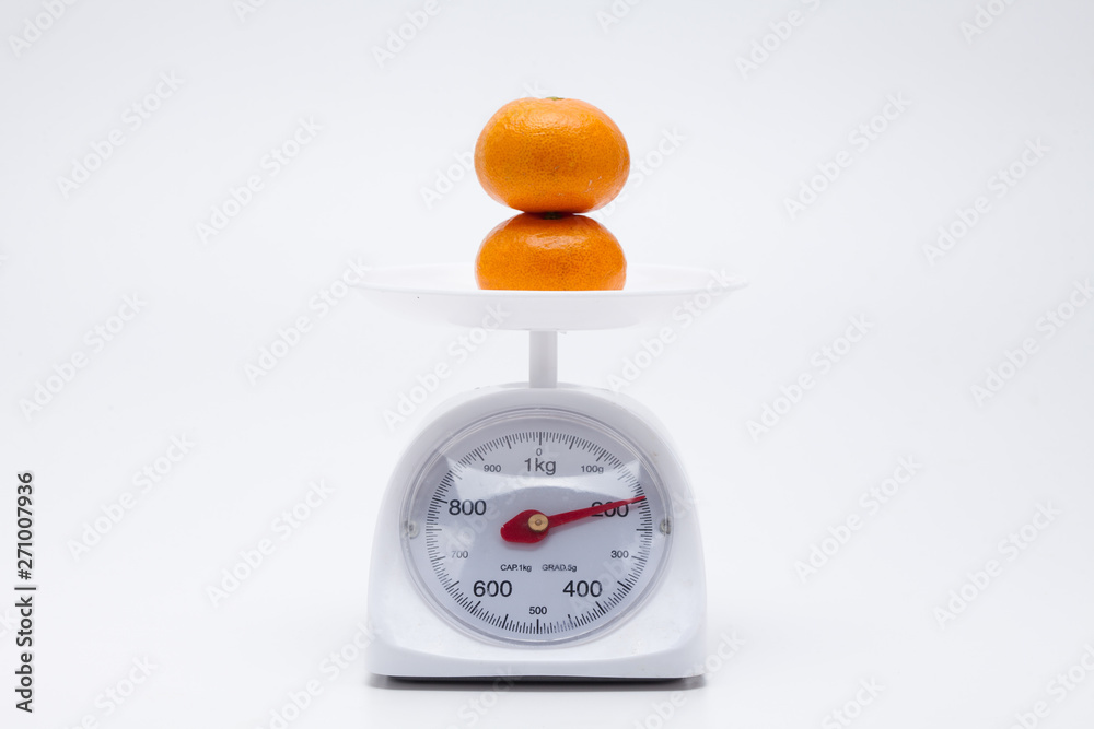 Healthy mandarin oranges on balance scale Stock Photo | Adobe Stock