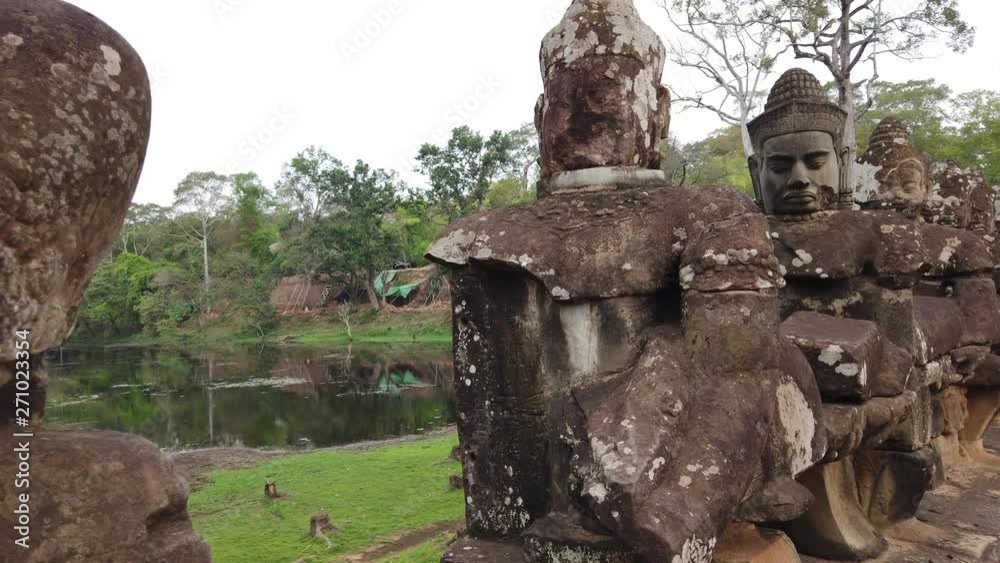 the bridge with the remains of stone figures, "giants" Asuras (evil ...