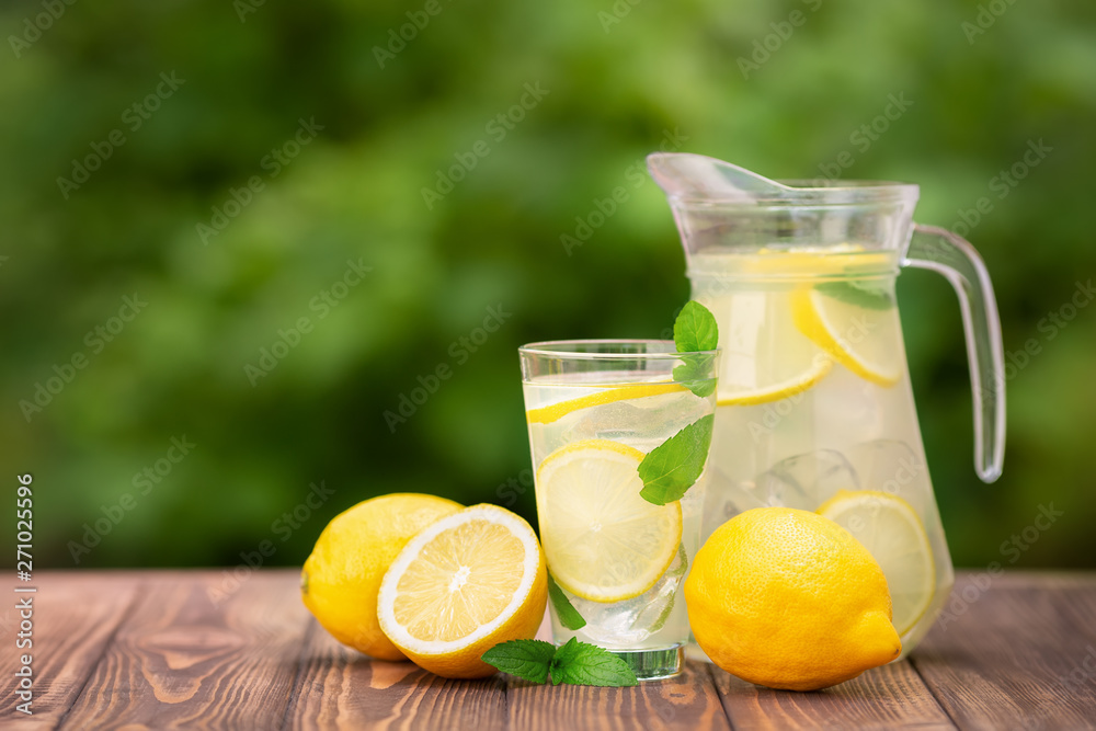 lemonade in glass and jug Stock Photo | Adobe Stock