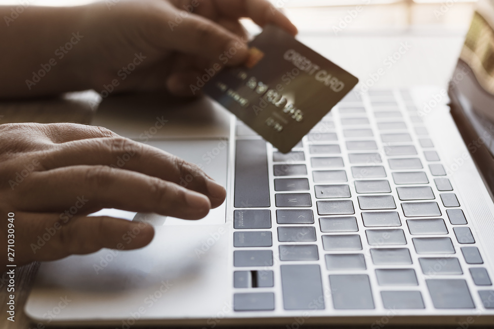Using laptop keyboard by hand to sent the credit card number for ...
