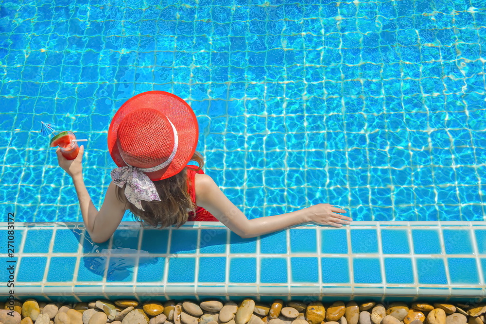 Women are relaxing at the poolside. woman relaxing in swimming pool spa ...