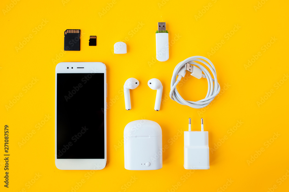 Mobile kit with smartphone, wireless headphones and chargers. Stock ...