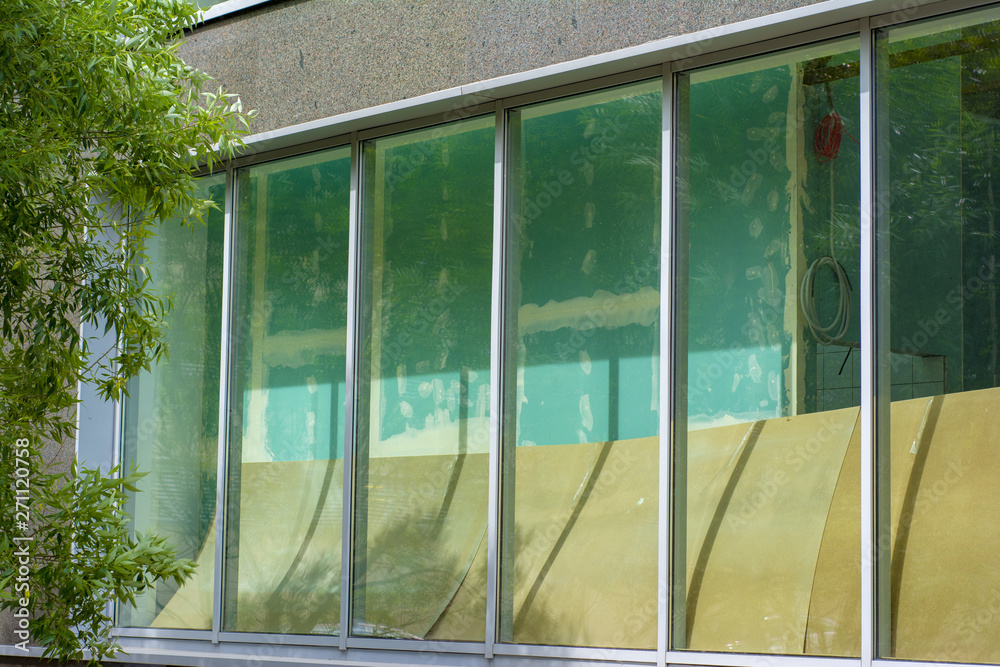 Cardboard closed windows during renovation in the office building in a ...