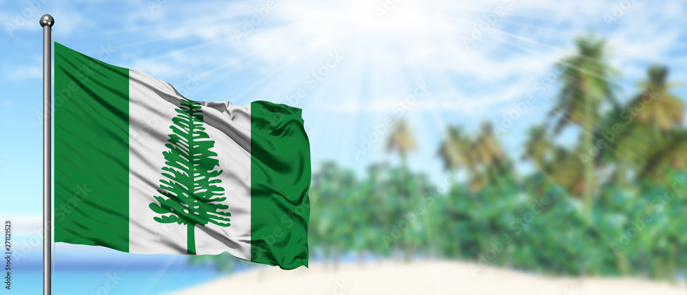 Waving Norfolk Island flag in the sunny blue sky with summer beach ...