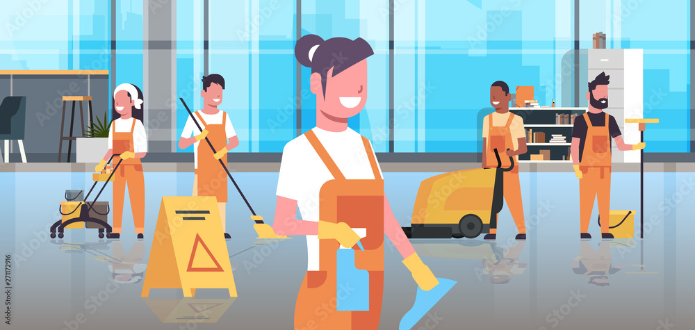 janitors team cleaning service concept cleaners team in uniform working ...