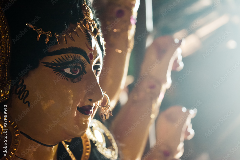 Close up side view face of Goddess Maa Durga Idol. A symbol of strength ...
