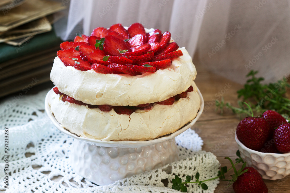 Pavlova meringue homemade cake with strawberries and cream on the ...