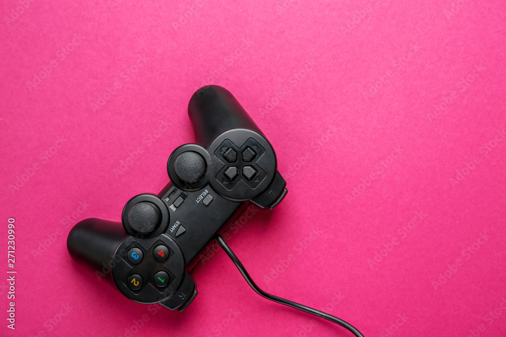 Modern game pad on color background Stock Photo | Adobe Stock