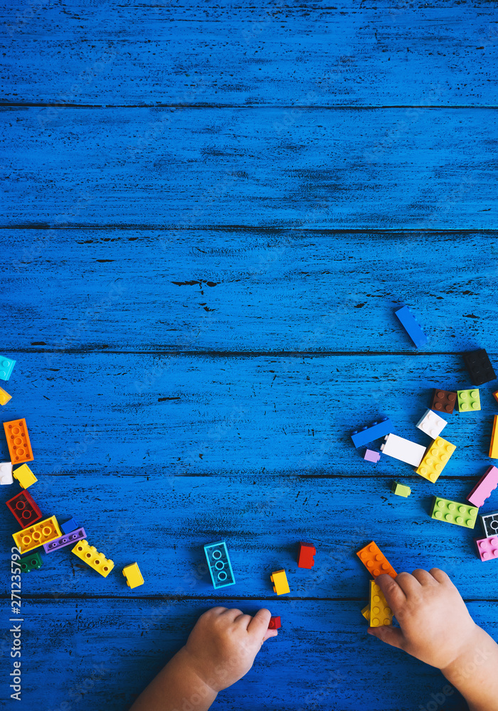 Building kids blocks on blue background Stock Photo | Adobe Stock