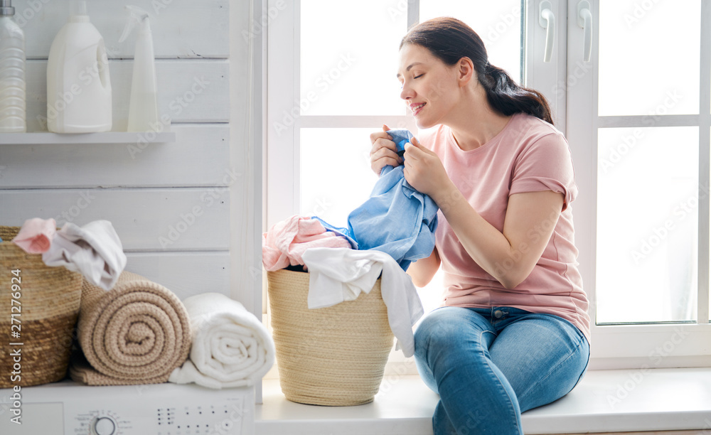 woman is doing laundry Stock Photo | Adobe Stock