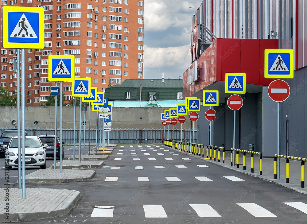 street and parking many road traffic signs pedestrian crossing and ...
