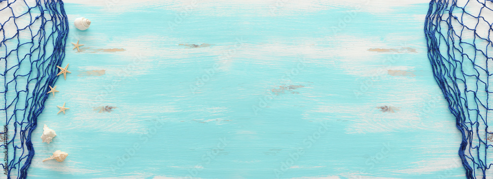 Top view of Fishnet on pastel blue wooden background. top view, flat ...