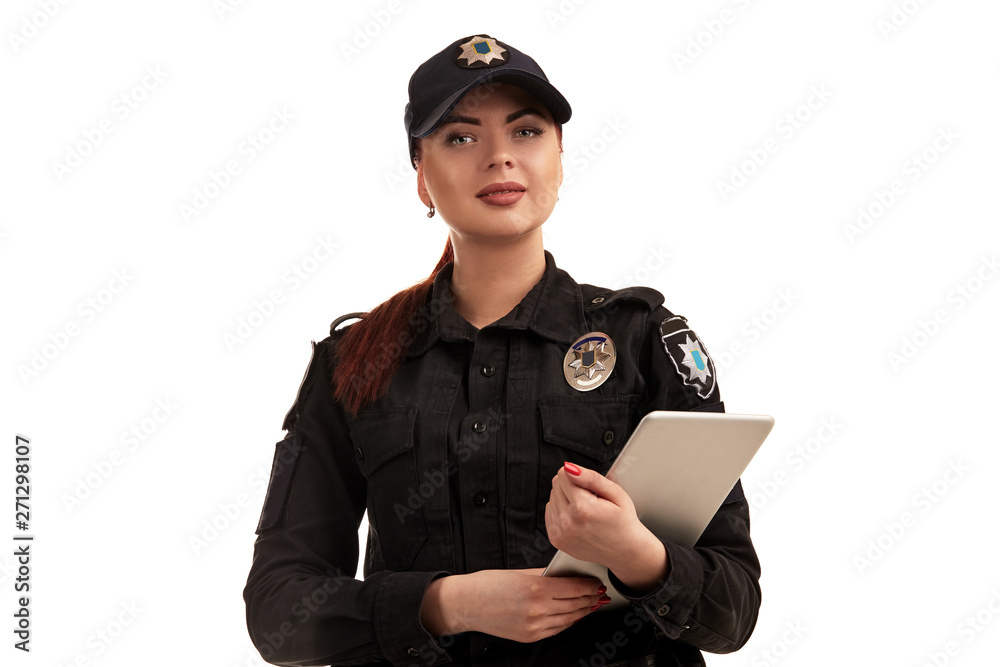 Close-up portrait of a female police officer is posing for the camera ...