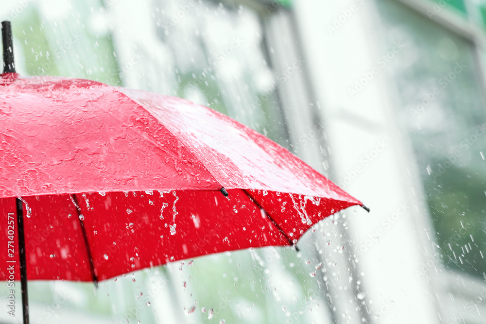 Red umbrella outdoors on rainy day Stock Photo | Adobe Stock