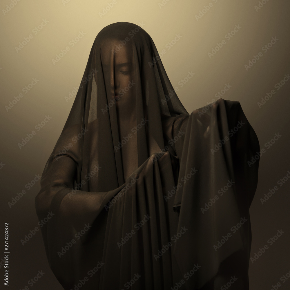 Girl in a black transparent veil on the face. Conceptual portrait in ...