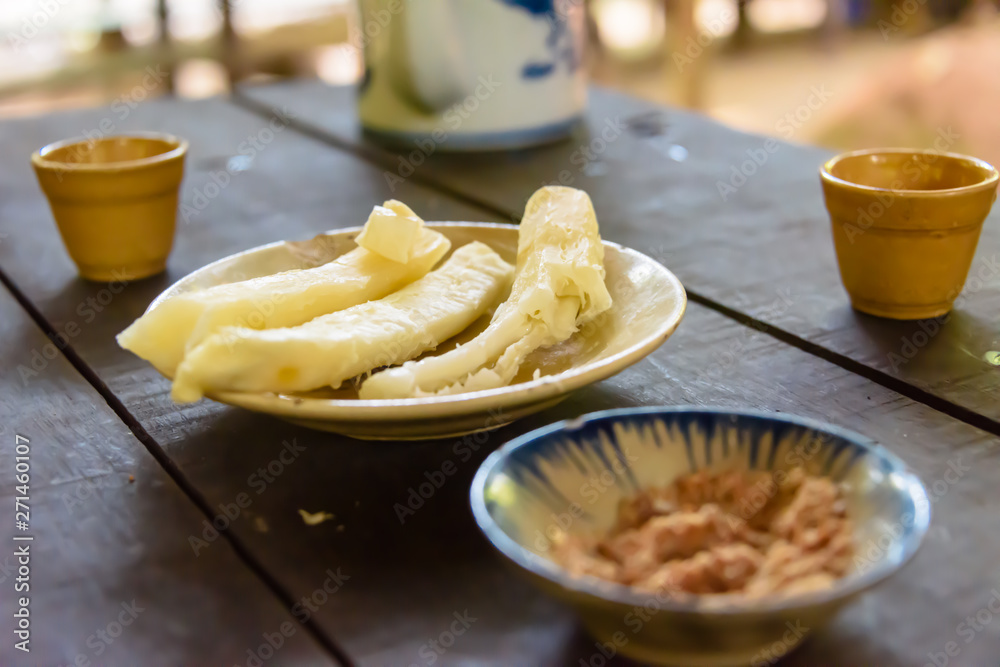 Plate of tapioca root which is dipped into a mix of salt, pepper and ...