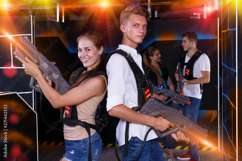 Team of laser tag guy and girl with laser pistols and friends Stock ...