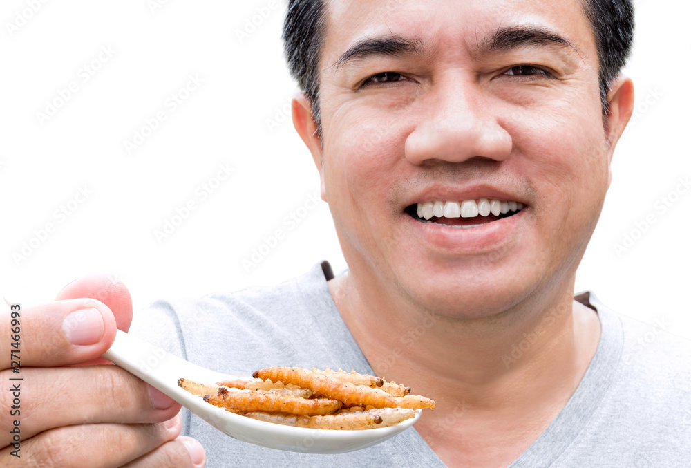 Food Insect: Man hand holding spoon eating Bamboo Worm insect or Bamboo ...
