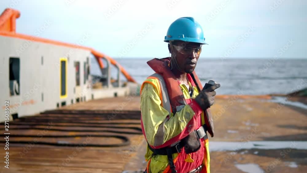 Video „Seaman AB or Bosun on deck of vessel or ship , wearing PPE ...