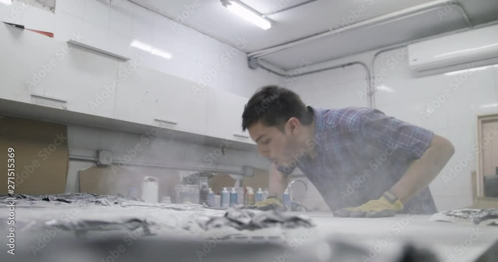 People at work in architecture design studio with plastic model and ...