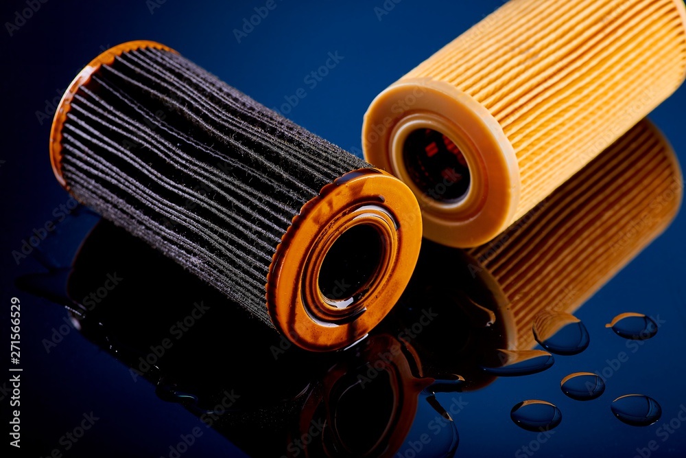 car engine oil filter on dark background Stock Photo | Adobe Stock