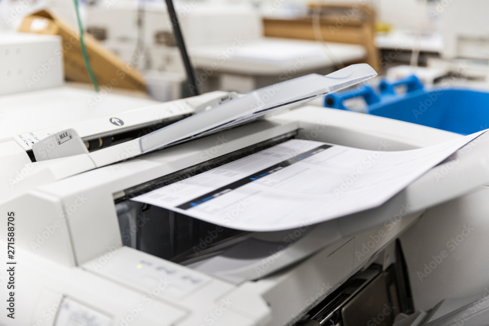 Printshop printer printing out A4 sheets for customer. Stock Photo ...