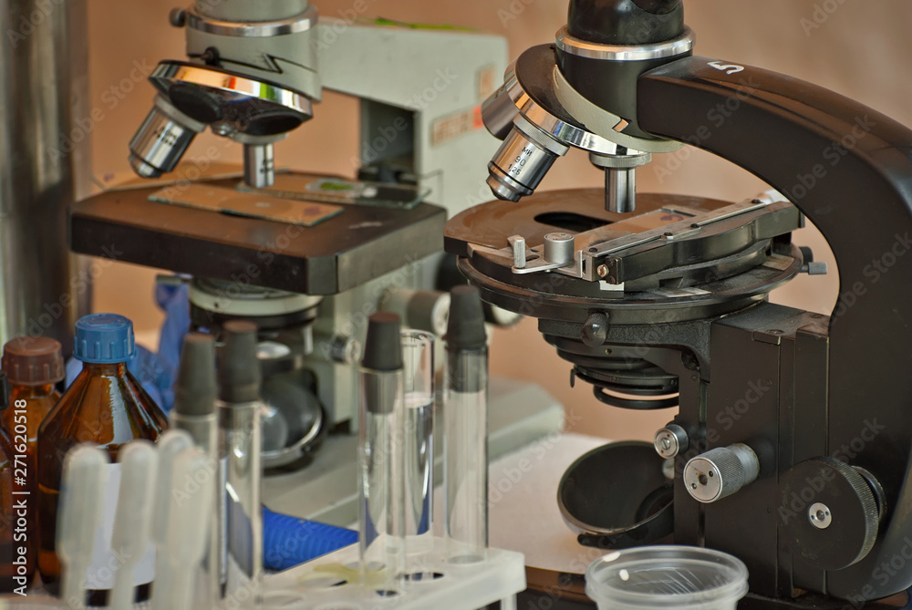 Microscope at a school scientific exhibition. Experiments on chemistry ...