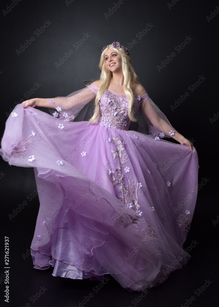 full length portrait of a blonde girl wearing a fantasy fairy inspired ...