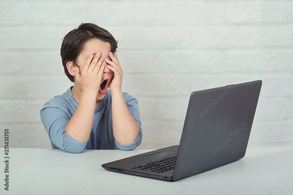 Little boy watching inappropriate content on laptop computer Stock ...