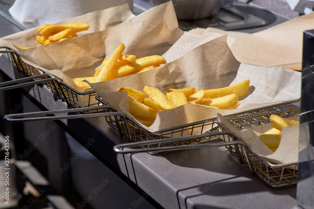 Cooking french fries. Closeup view of making french fries deep frying ...