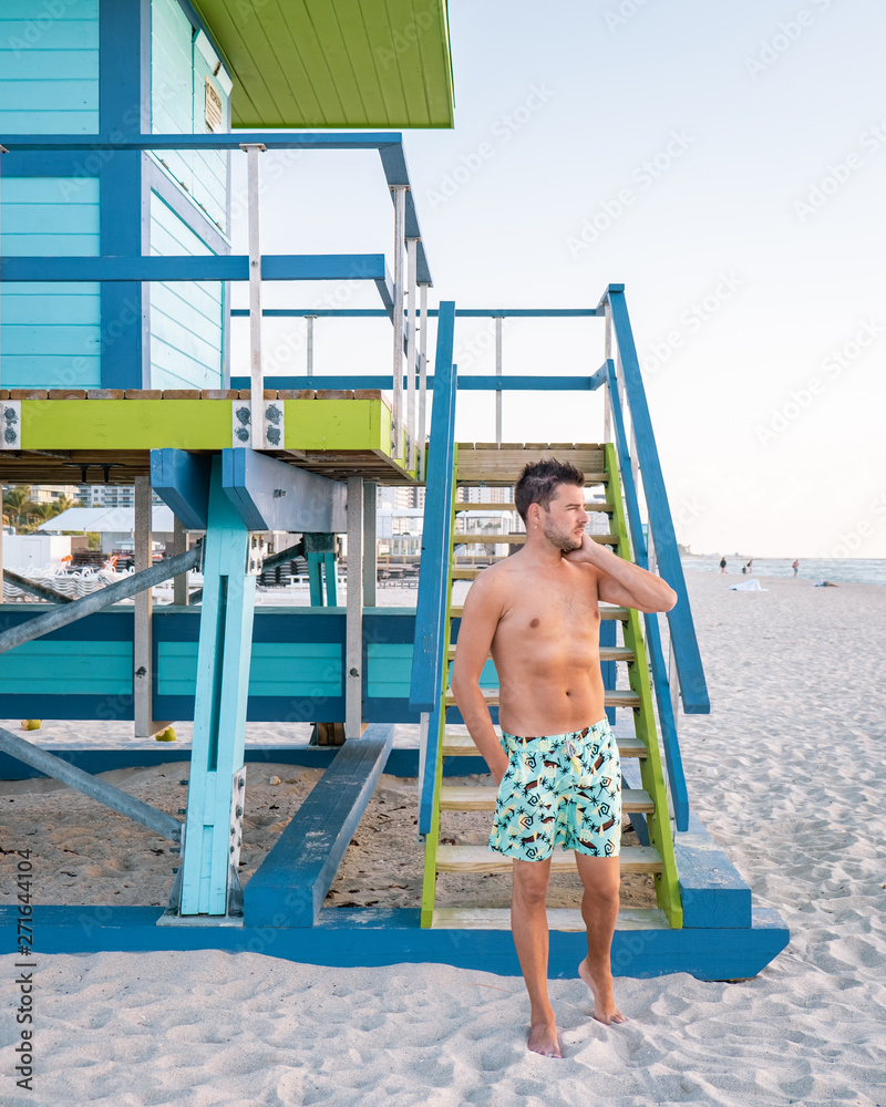 Miami South Beach Florida, young men on the beach in swim short, mid ...