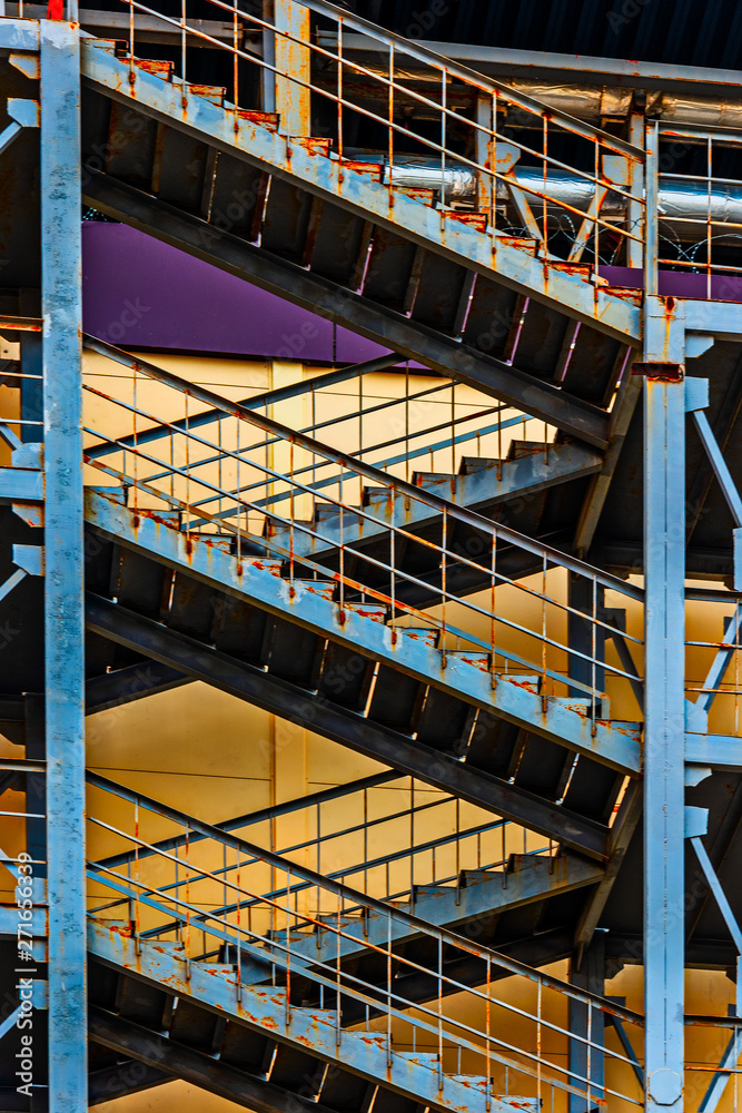 Outside metal fire escape stairs. Metal fire escape stairs mounted on ...