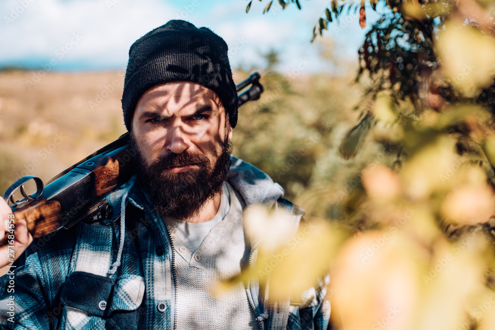 Hunter with shotgun gun on hunt. Close up Portrait of hamdsome Hunter ...