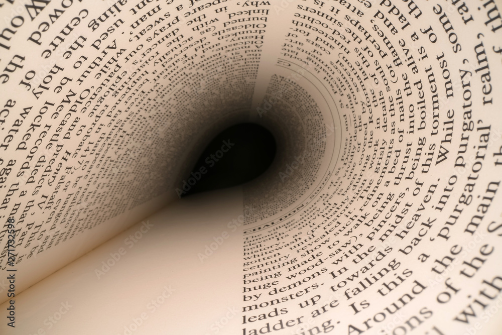 Inside the book concept. Latin letters and words on an tunnel shaped ...