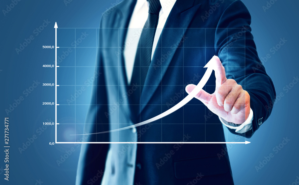 Businessman showing business growth on a chart, hands touch the graph ...