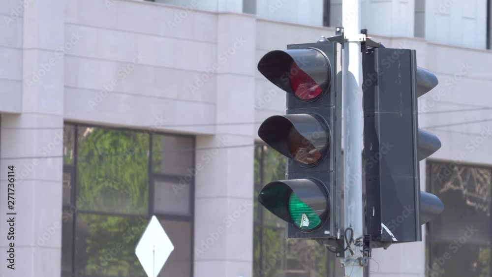 A traffic light above the road regulates the road. Close-up. Change the ...