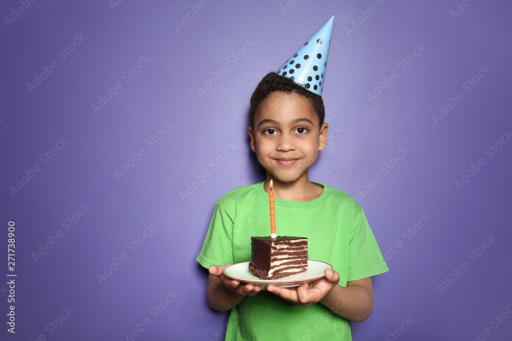 Portrait of cute little boy with Birthday cake on color background ...