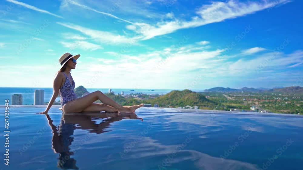 locked wide angle shot of a young and slim female model woman in ...