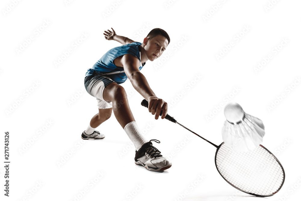 Little boy playing badminton isolated on white studio background. Young ...