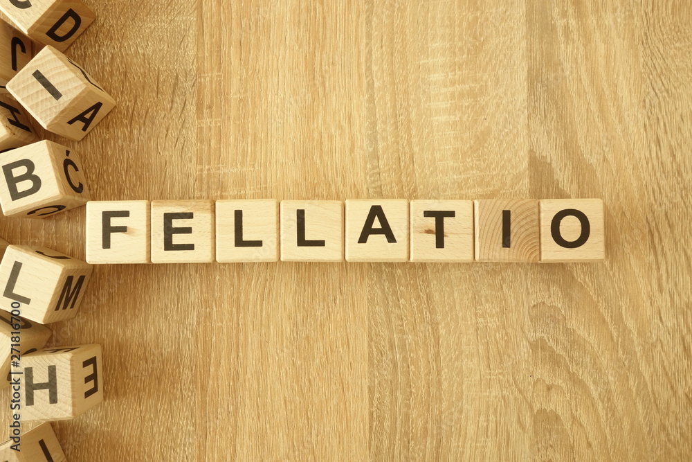 Word fellatio from wooden blocks on desk Stock Photo | Adobe Stock