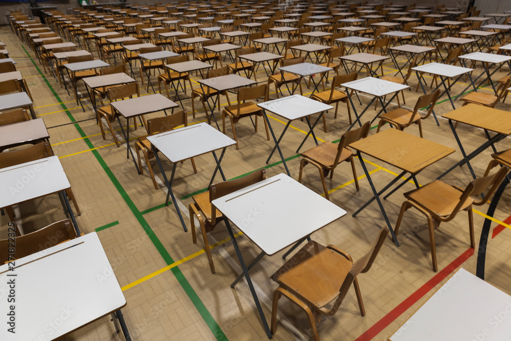 Exam tables set up in a sports hall for exams in a high school & sixth ...