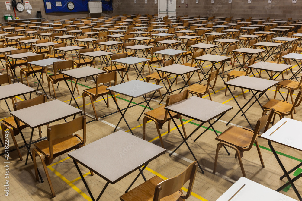 Exam tables set up in a sports hall for exams in a high school & sixth ...