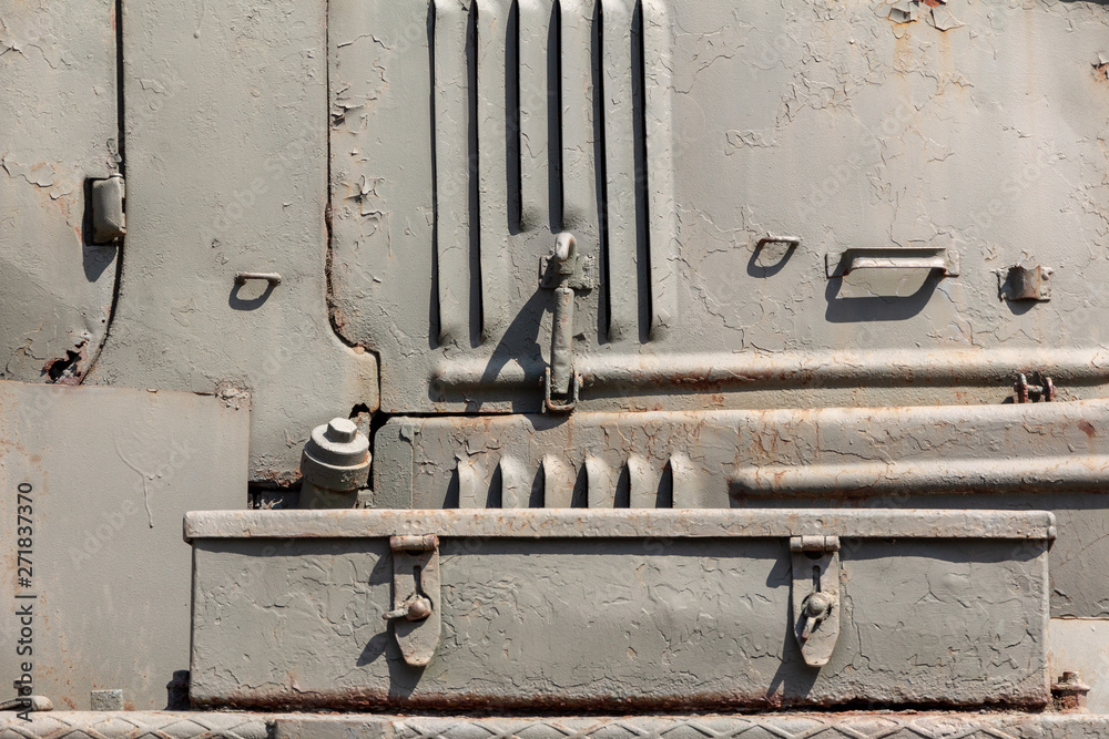 metal parts of the body of military equipment close-up. Armored war ...