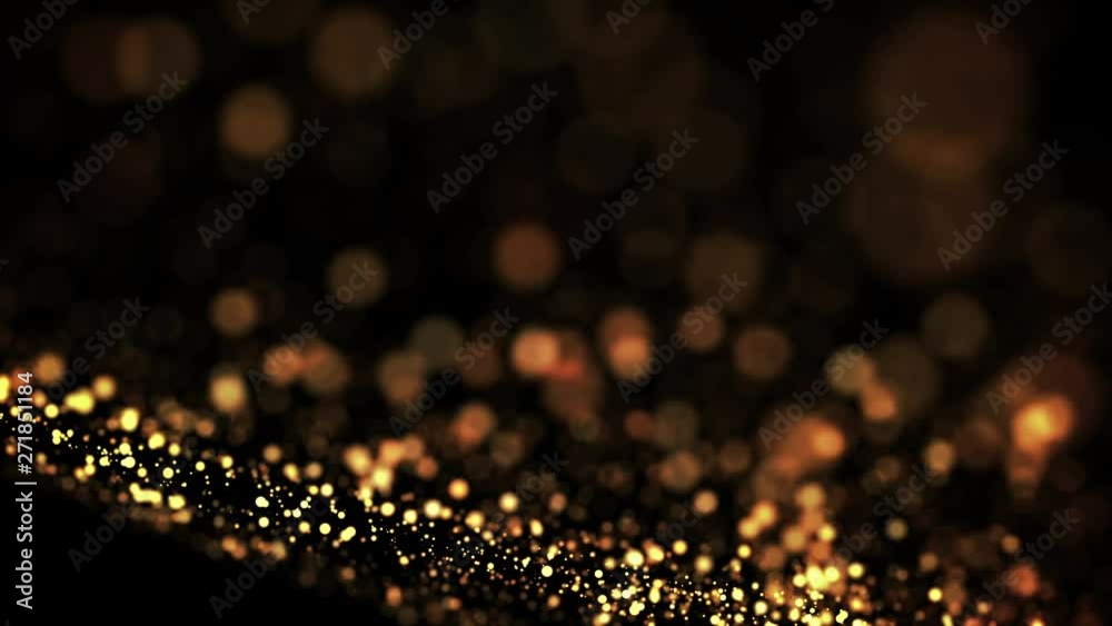 gold particles in liquid float and glisten. Background with glittering golden particles depth of ...