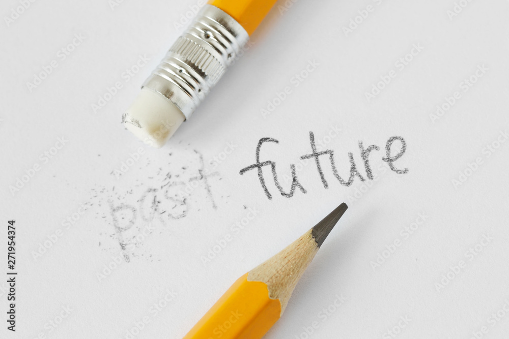 The word past erased with a rubber and the word future written with a ...