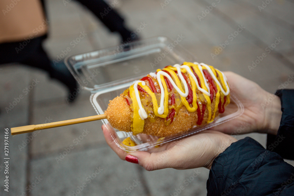 A street food called Korean cheese corn dog, It's cheese on a stick ...