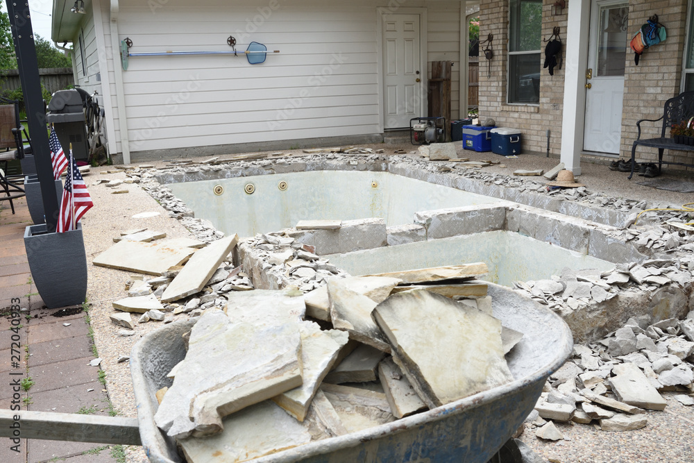 Empty swimming pool after demolishing old tile and coping for remodel ...