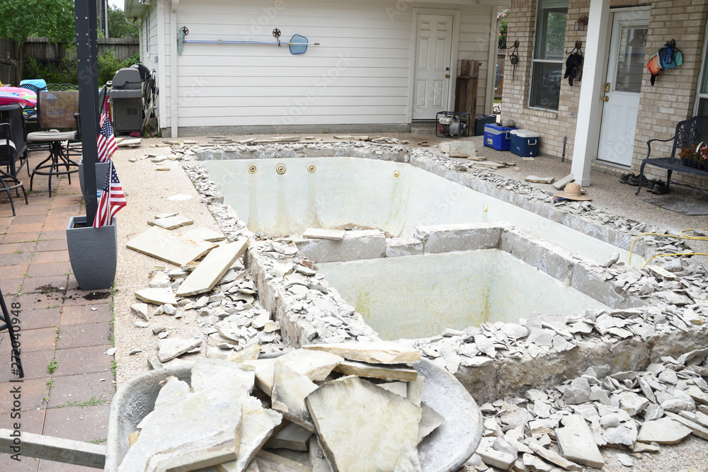 Empty swimming pool after demolishing old tile and coping for remodel ...