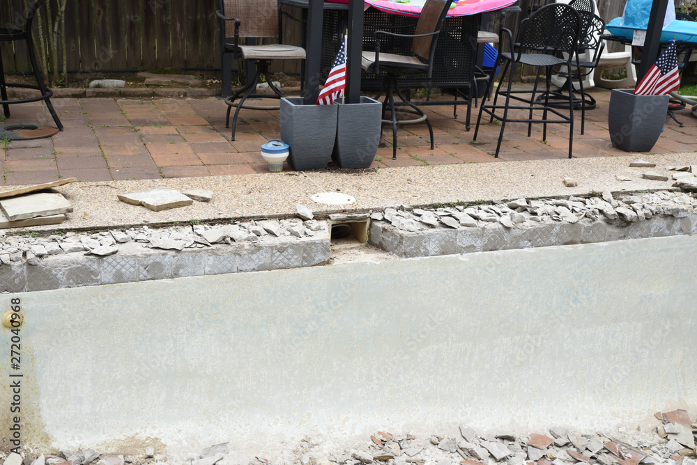 Empty swimming pool after demolishing old tile and coping for remodel ...