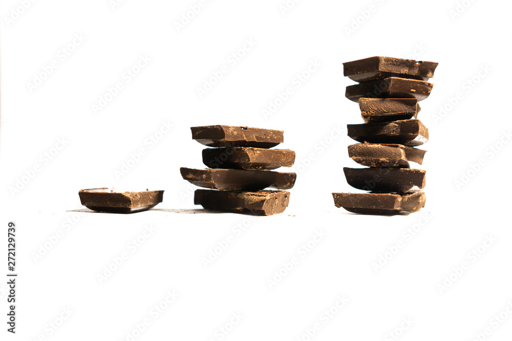 The concept of a profit graph made of chocolate cubes isolated on white ...